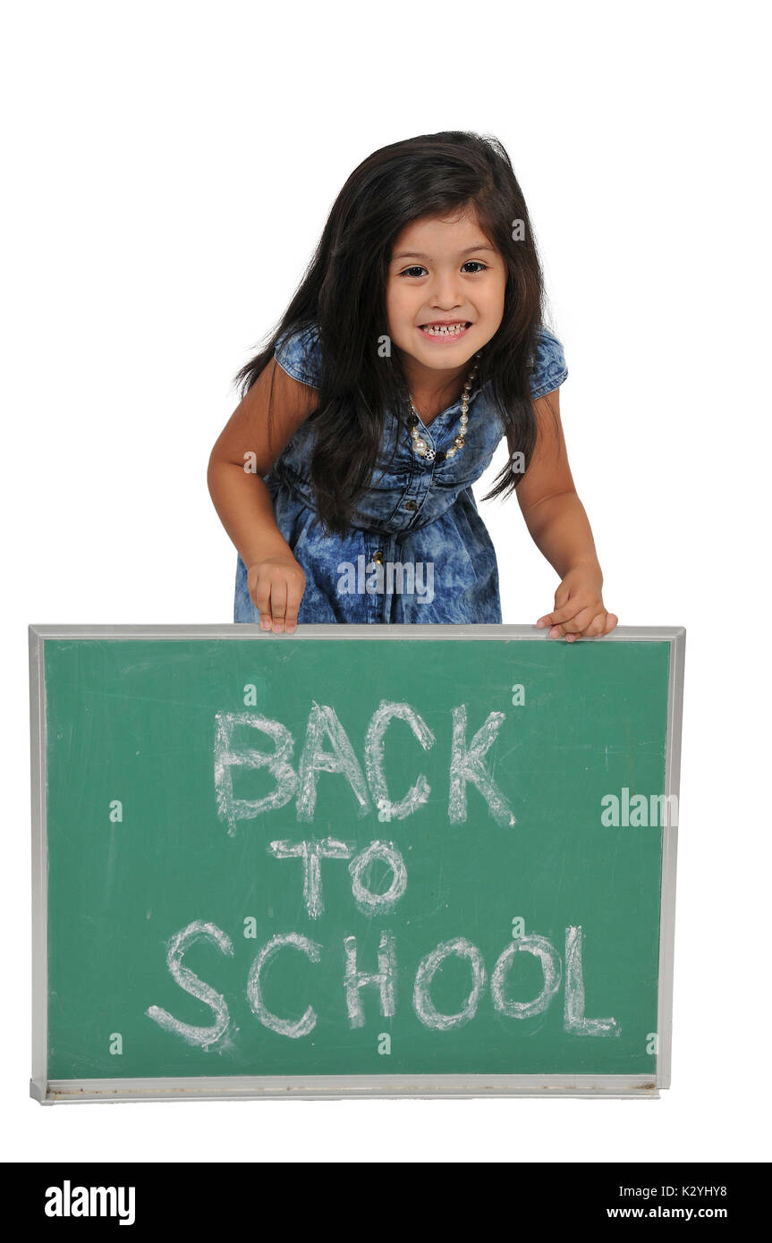 Beautiful little girl holding a back to school sign Stock Photo - Alamy