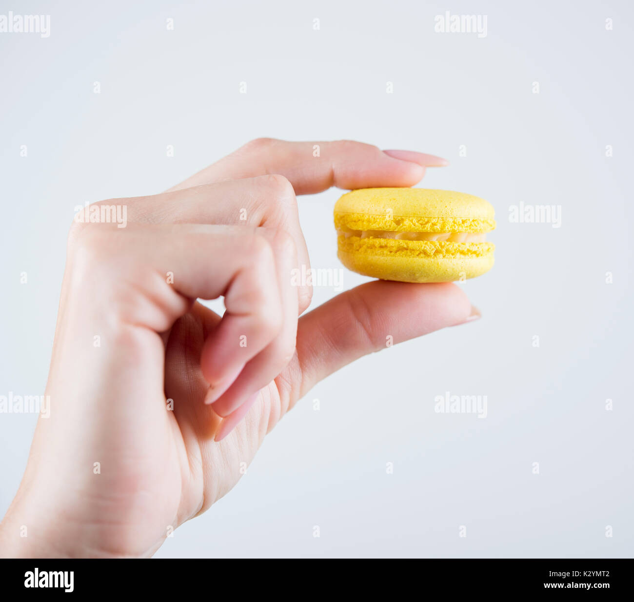 macarons in hand Stock Photo - Alamy