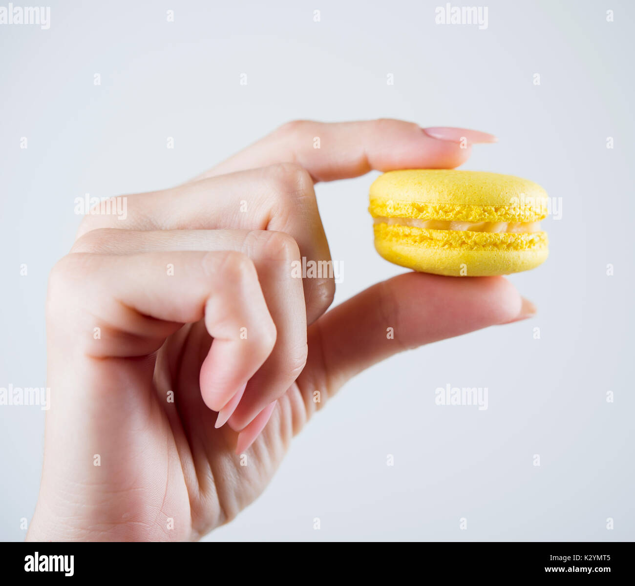 macarons in hand Stock Photo - Alamy