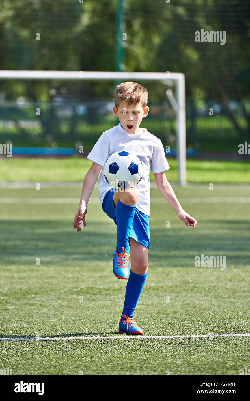 Boy playing soccer uniform hi-res stock photography and images - Alamy