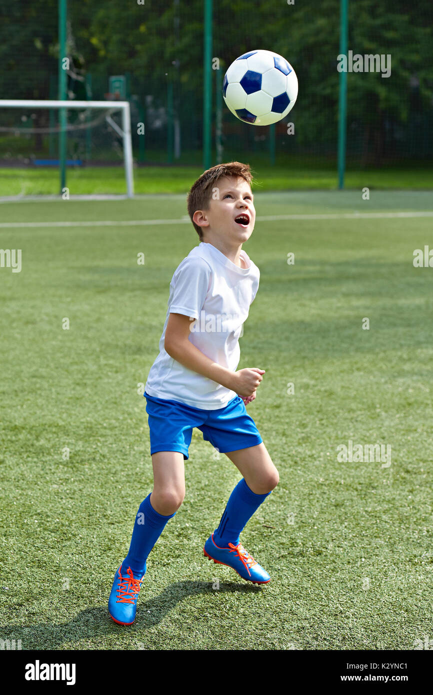 Boy playing soccer uniform hi-res stock photography and images - Alamy