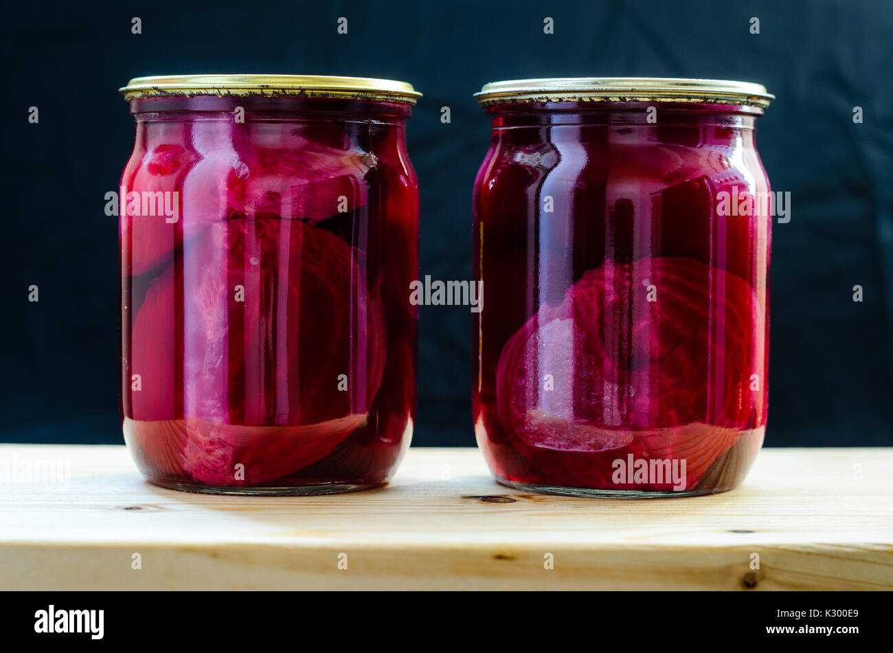 Two cans of canned beets on black background close-up Stock Photo - Alamy