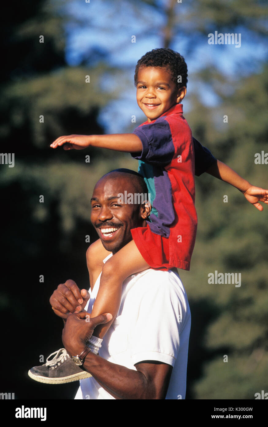 Son riding on fathers shoulders hi-res stock photography and images - Alamy