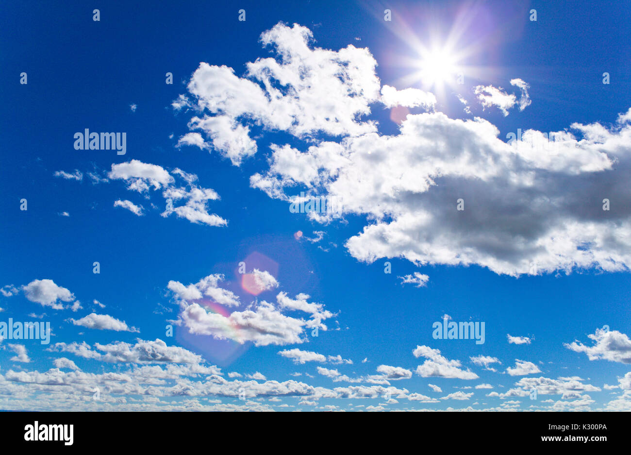 White puffy clouds sun sky hi-res stock photography and images - Alamy