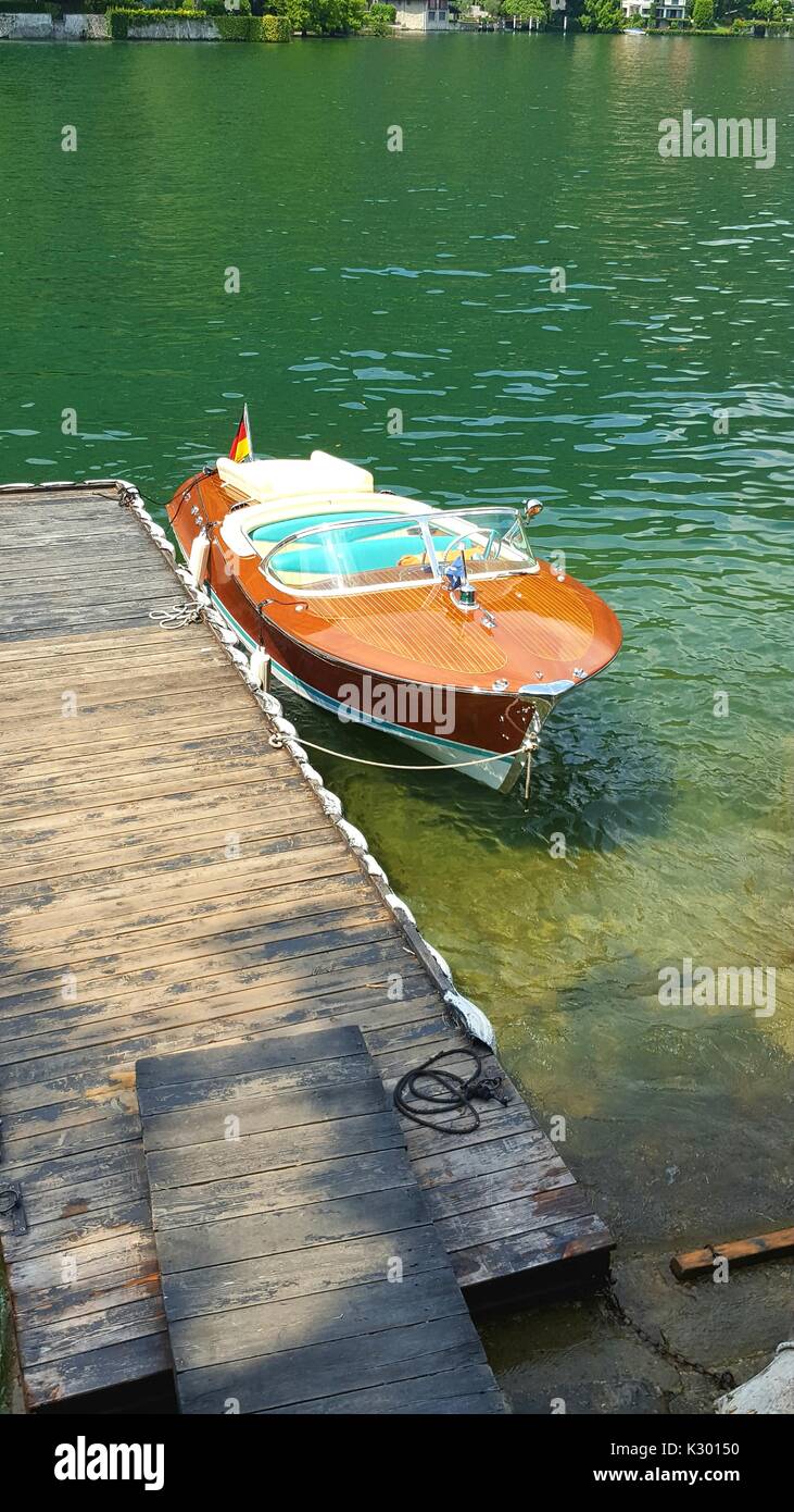 Small boat at a dock on Lake Como Stock Photo - Alamy