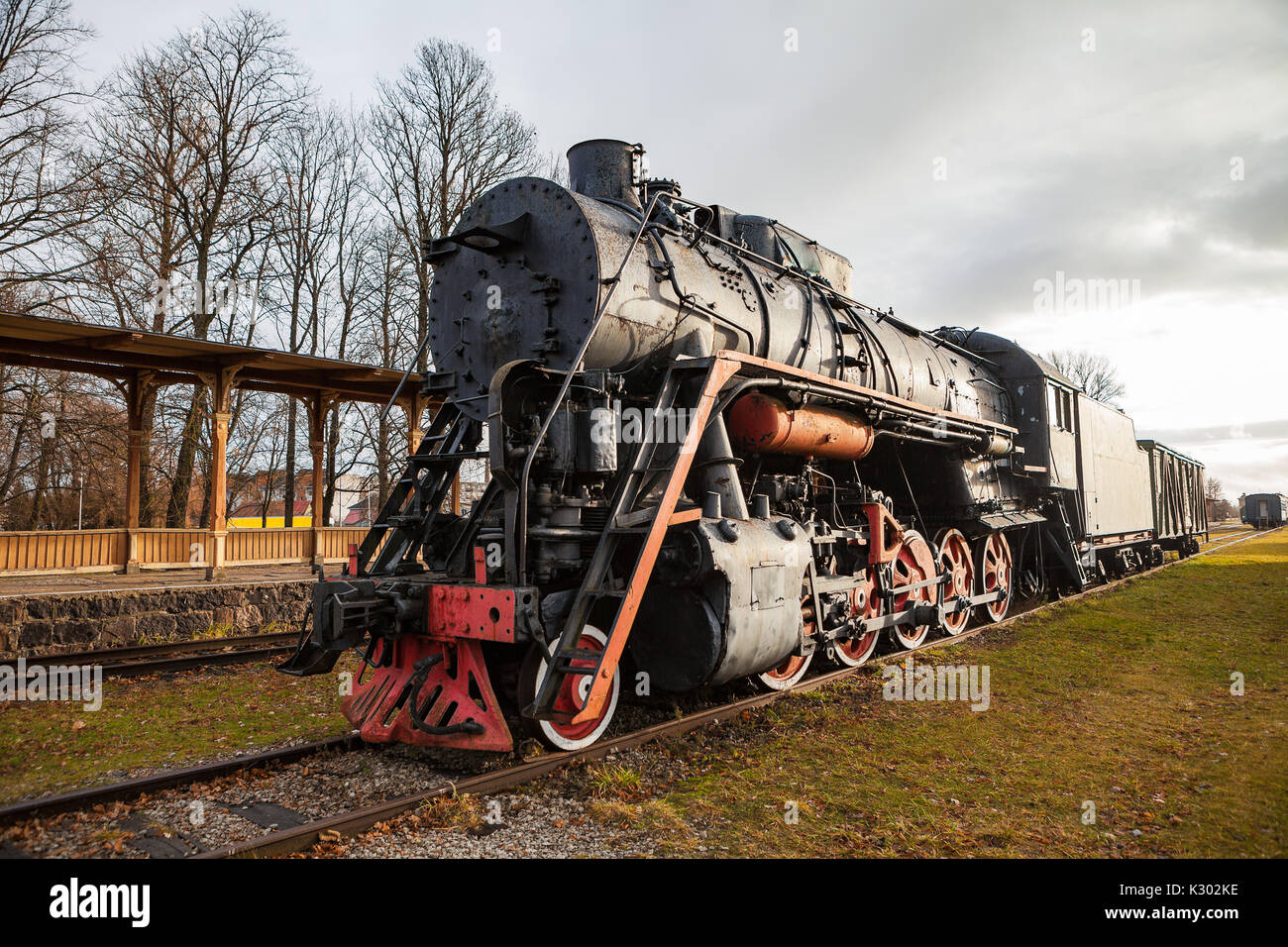 Old vintage steam locomotive from XX century, black and red color ...