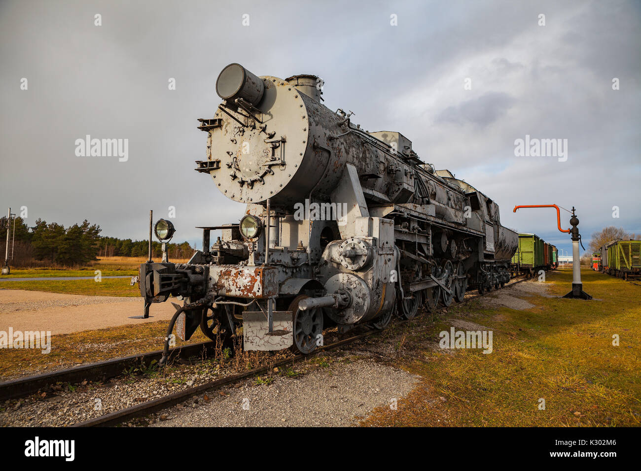Old vintage steam locomotive from XX century, grey color. Russian ...