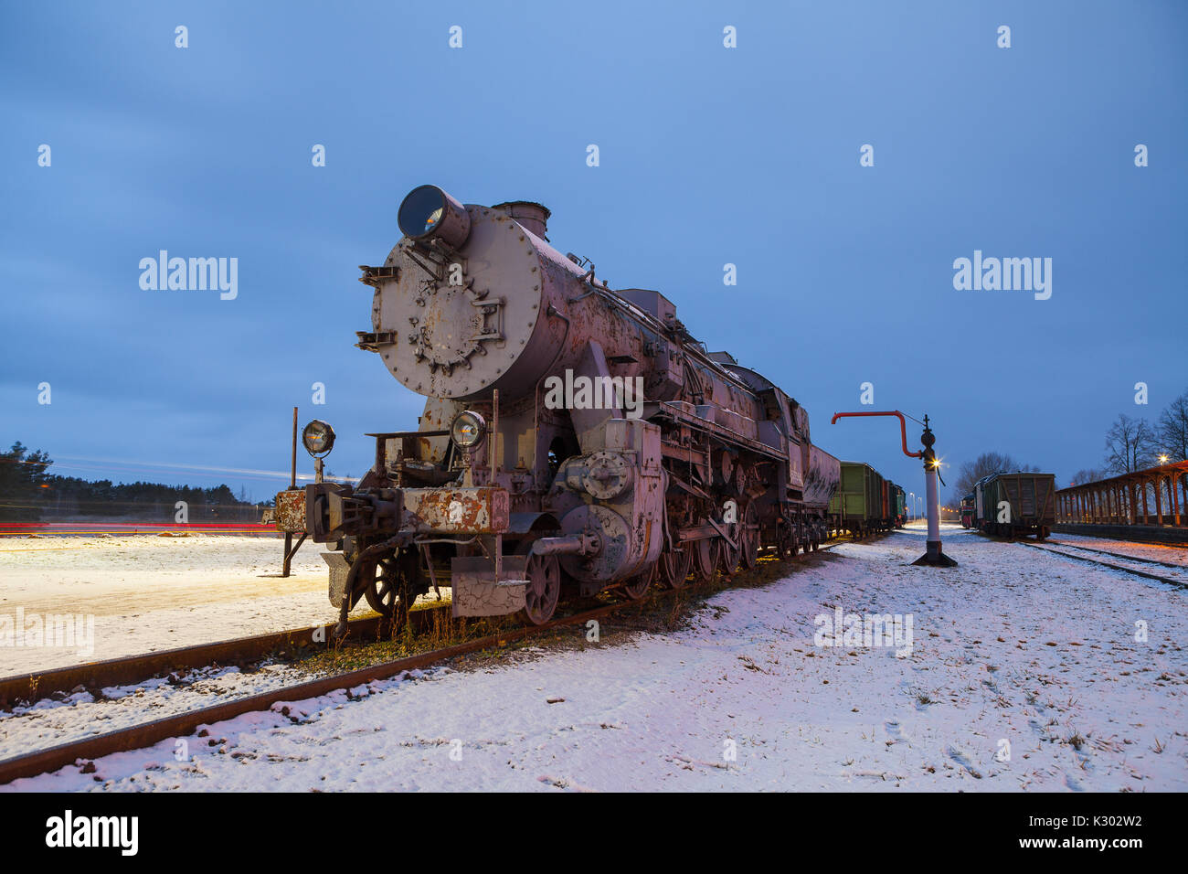 Old steam train at night. Vintage rural station. Winter time Stock ...