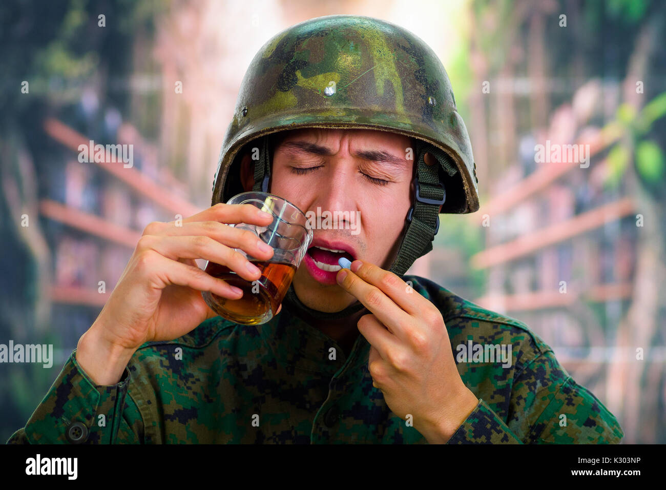 Handsome young soldier wearing uniform suffering from stress post-war ...