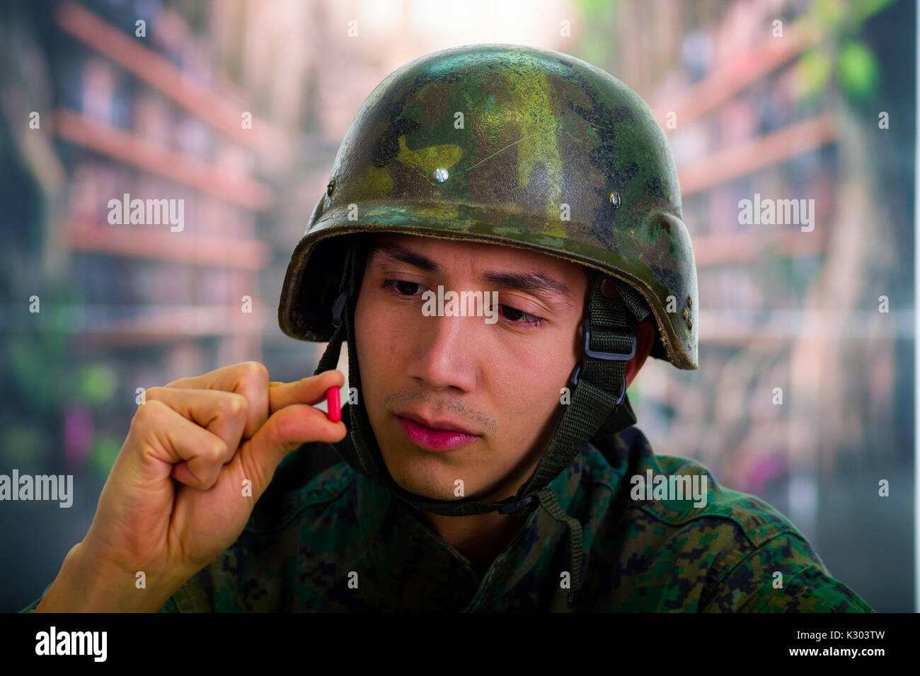 Handsome young soldier wearing uniform suffering from stress post-war ...