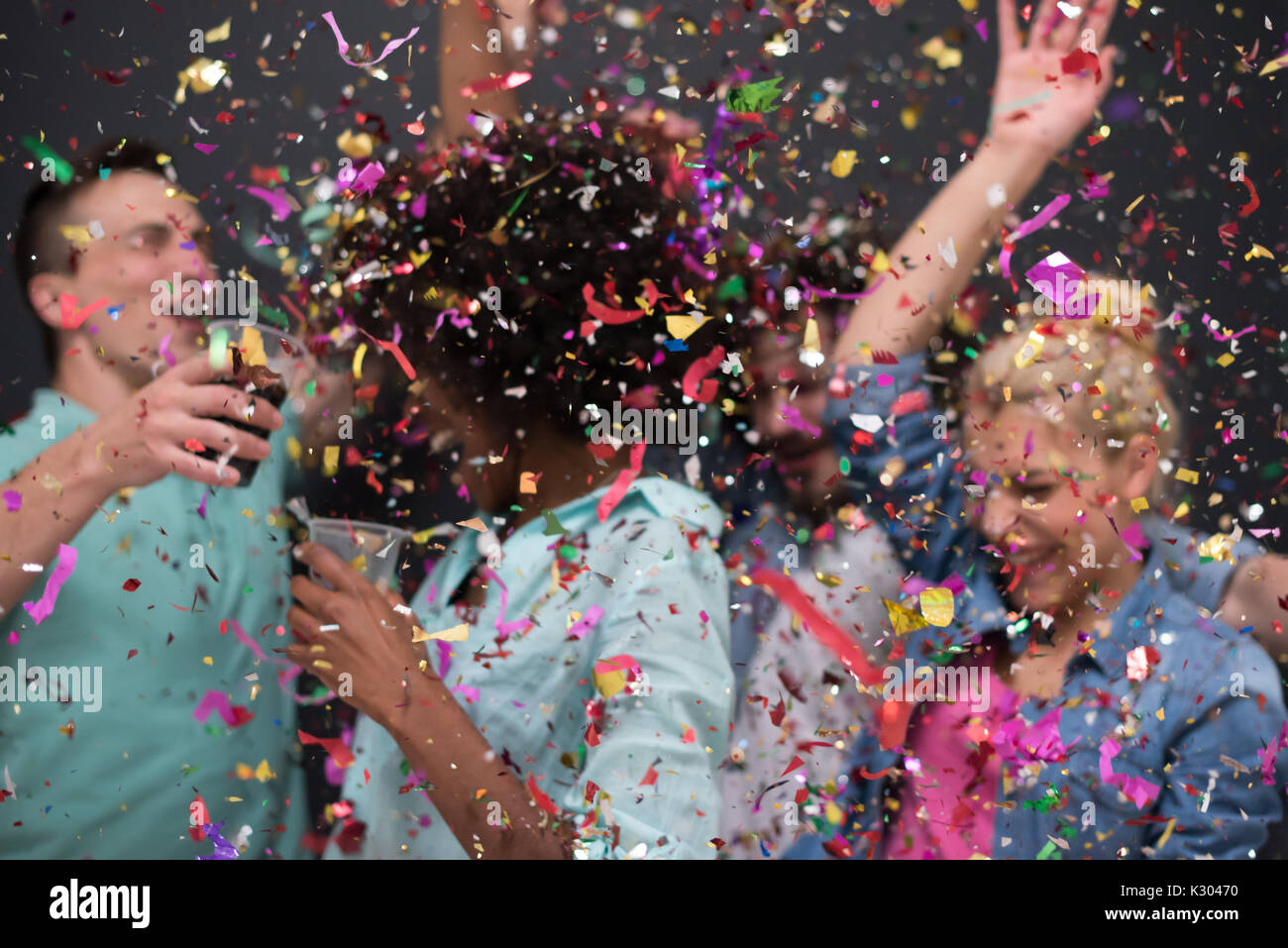 confetti party Multiethnics group of happy young people celebrating new ...