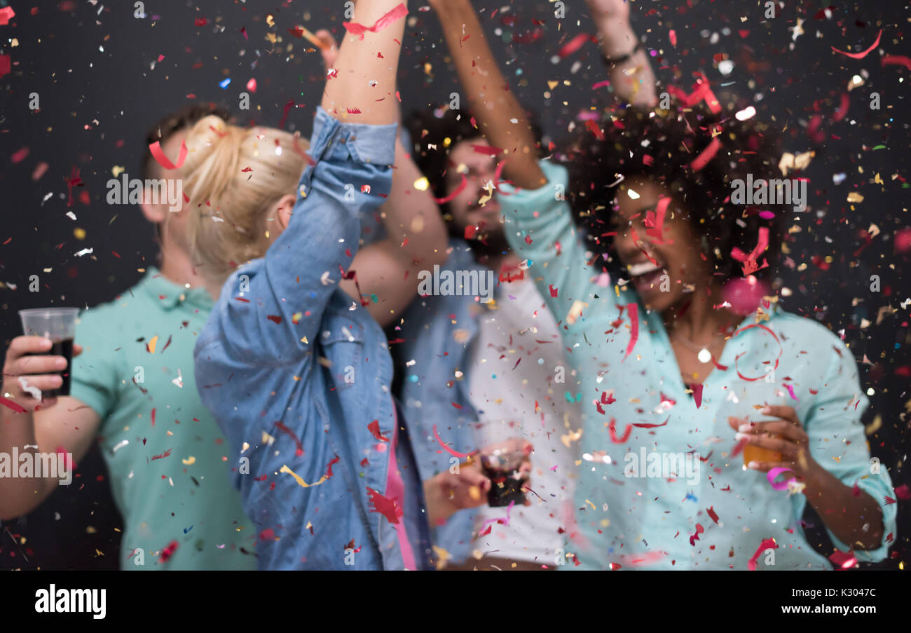 confetti party Multiethnics group of happy young people celebrating new ...