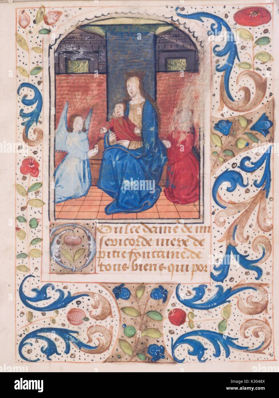 Illuminated manuscript page depicting the Blessed Virgin holding baby ...