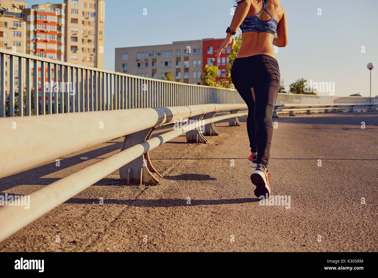 Jogging young woman in the city hi-res stock photography and images - Alamy