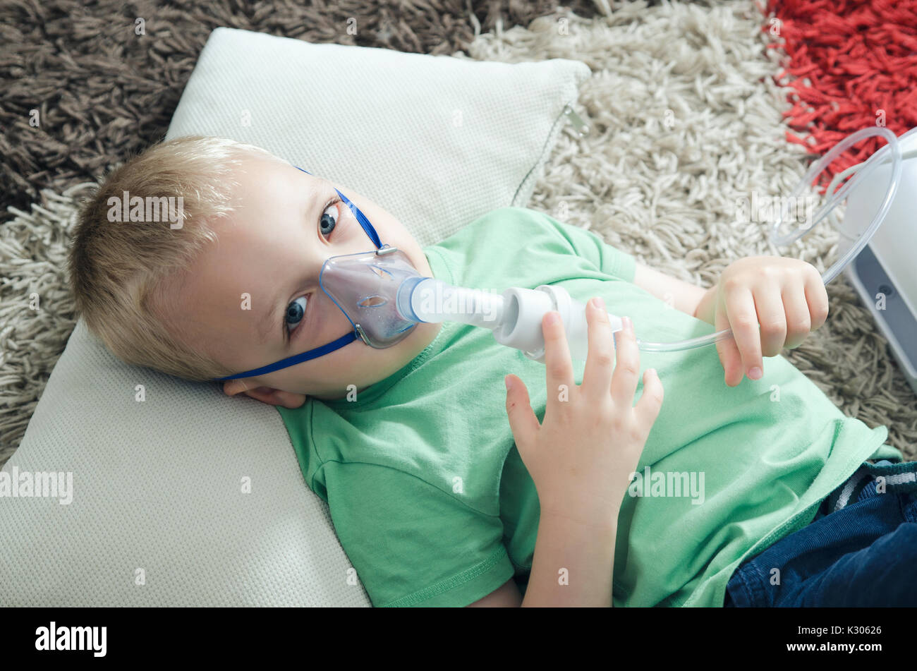 Boy making inhalation with nebulizer at home. child asthma inhaler ...