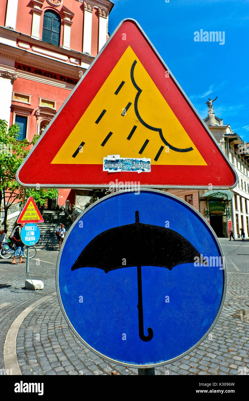 Unusual road sign with umbrella. Rain warning. Weather, climate, danger ...