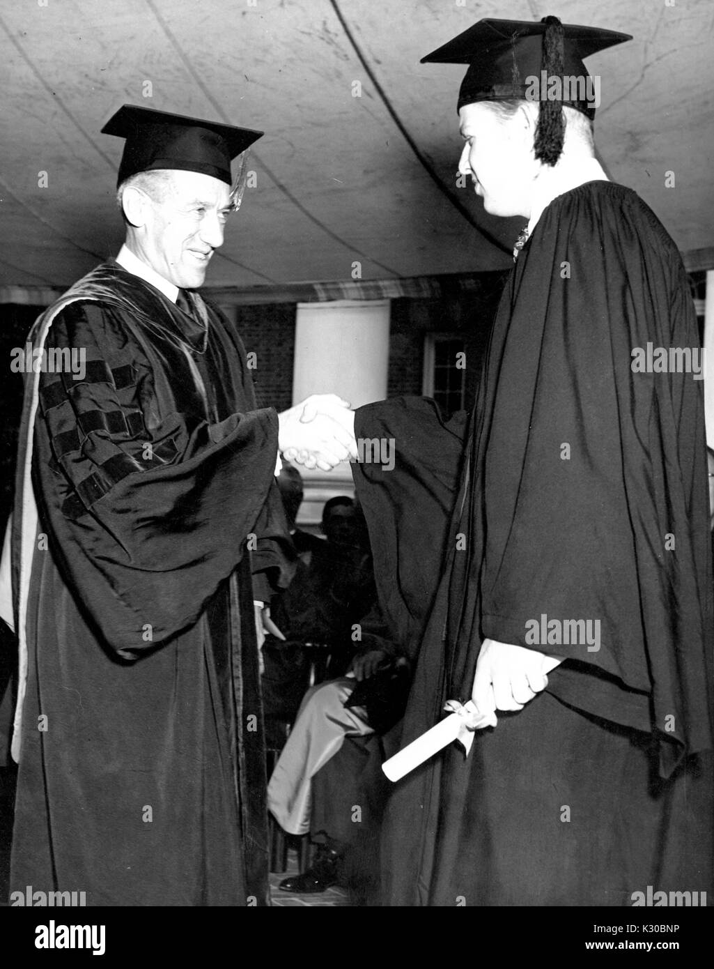 Johns Hopkins University President Detlev Wulf Bronk congratulates a ...
