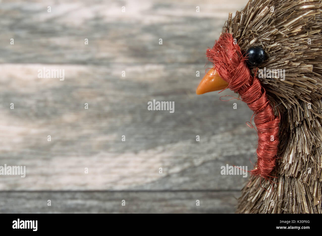 Straw turkey in front of rustic wood background Stock Photo - Alamy