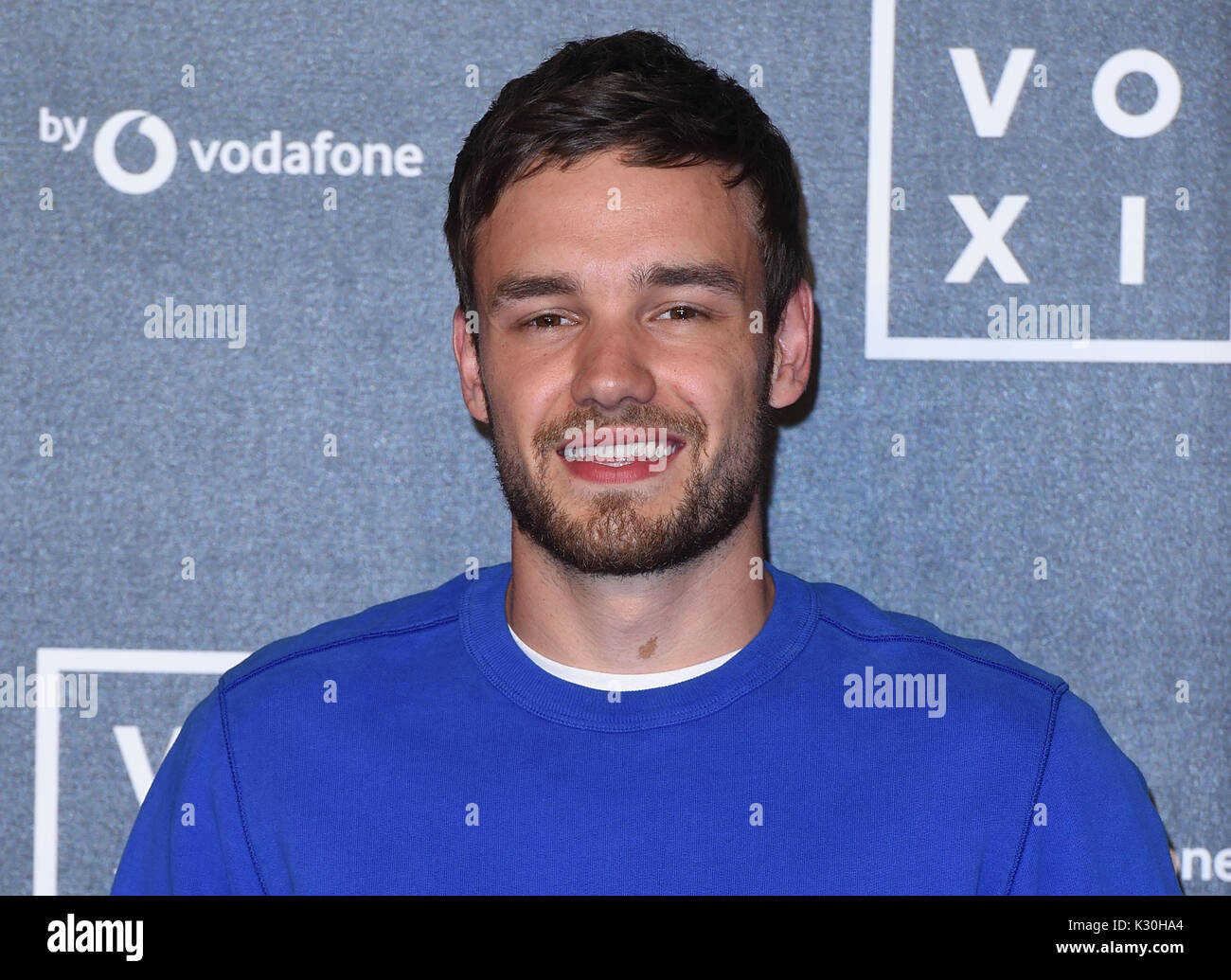 Liam Payne attends an event to mark the launch of new mobile VOXI at ...