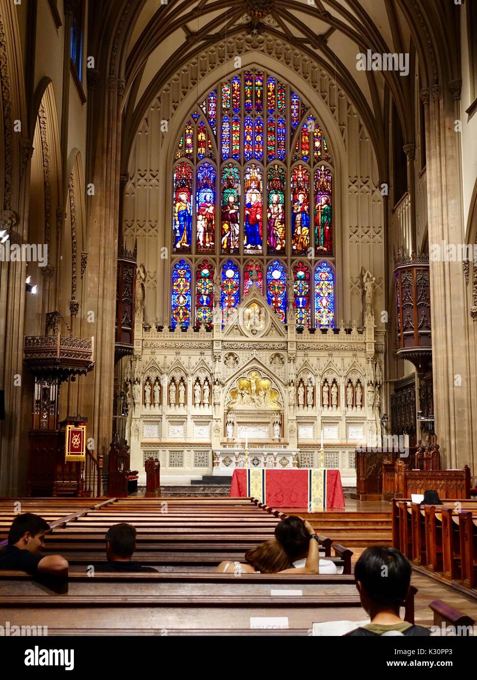 Trinity Church Wall Street, New York, NY, USA. Worshippers sit in pews ...