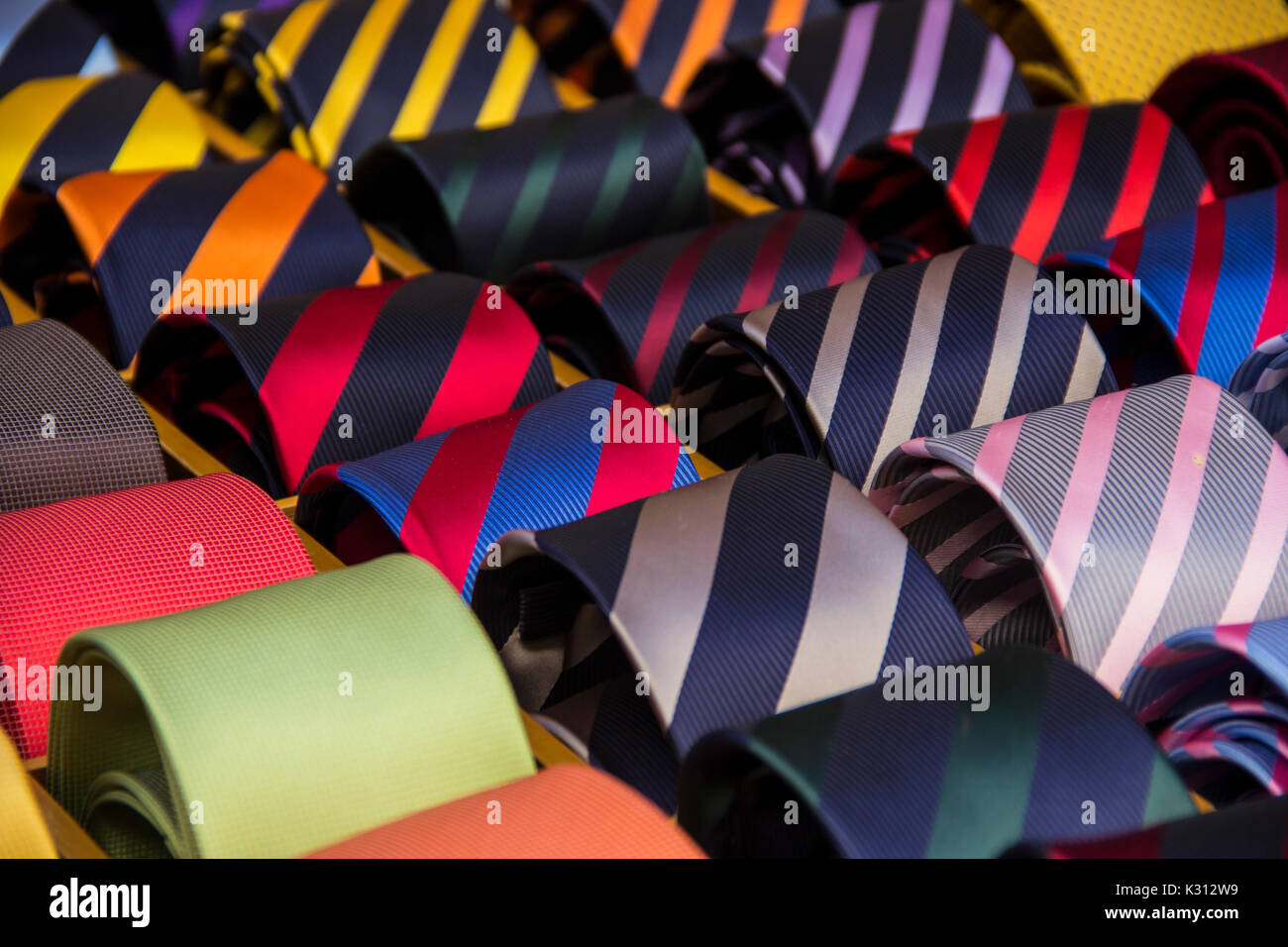 Colorful neckties coiled, fashion accessory Stock Photo - Alamy
