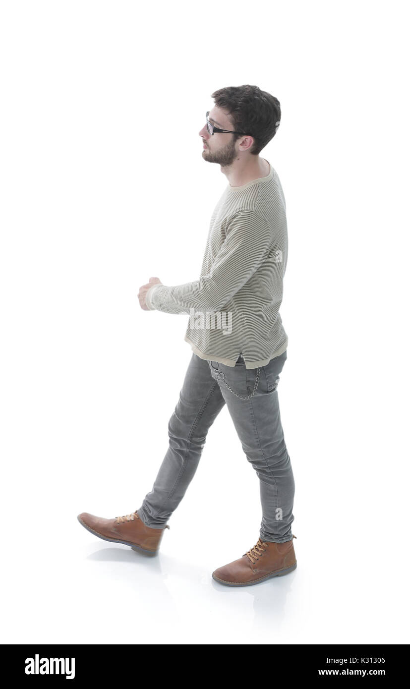 side view. modern young man confidently goes forward Stock Photo - Alamy