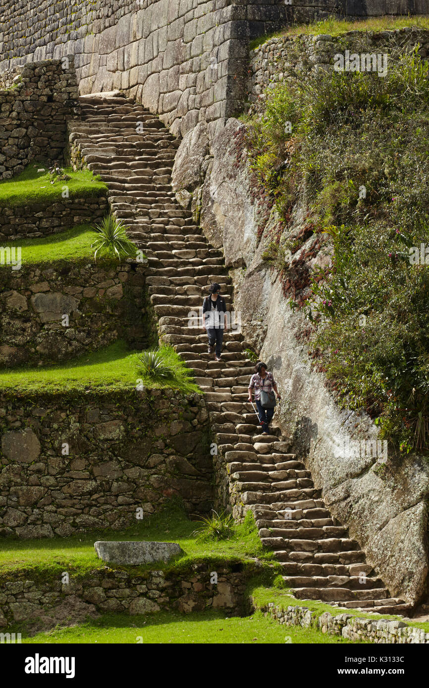 Tourists on stone stairway, Machu Picchu Inca ruins (World Heritage ...