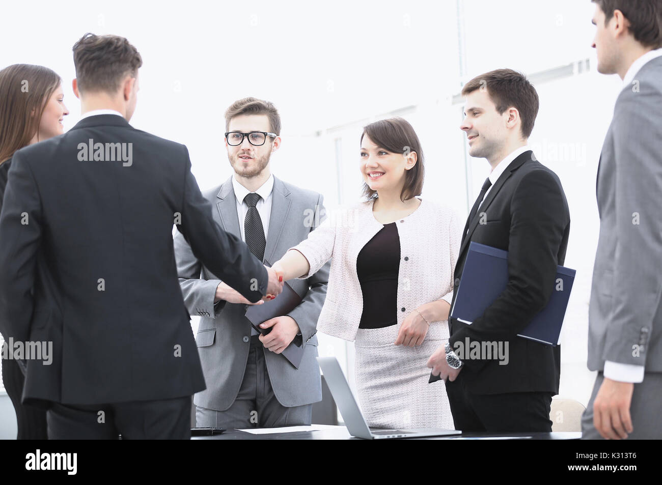 handshake of business partners standing next to their lawyers Stock Photo - Alamy