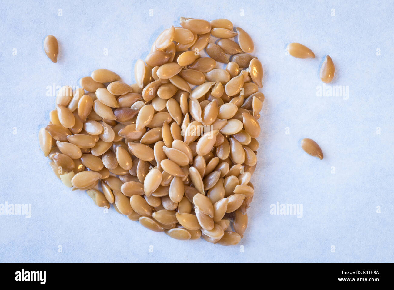 Flax Seed in a Heart Shape Stock Photo - Alamy