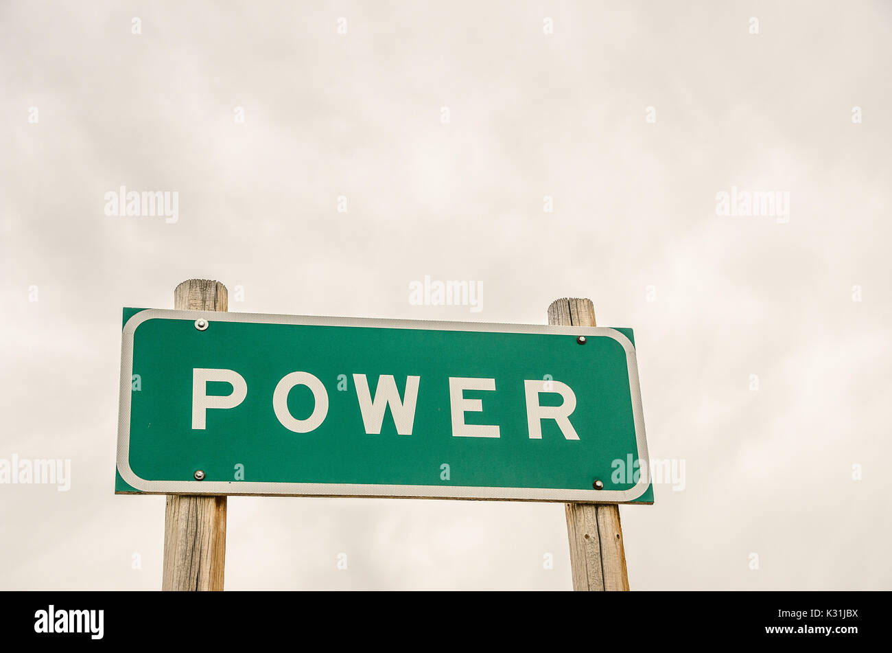 Green and white sign for power representing authority, control ...