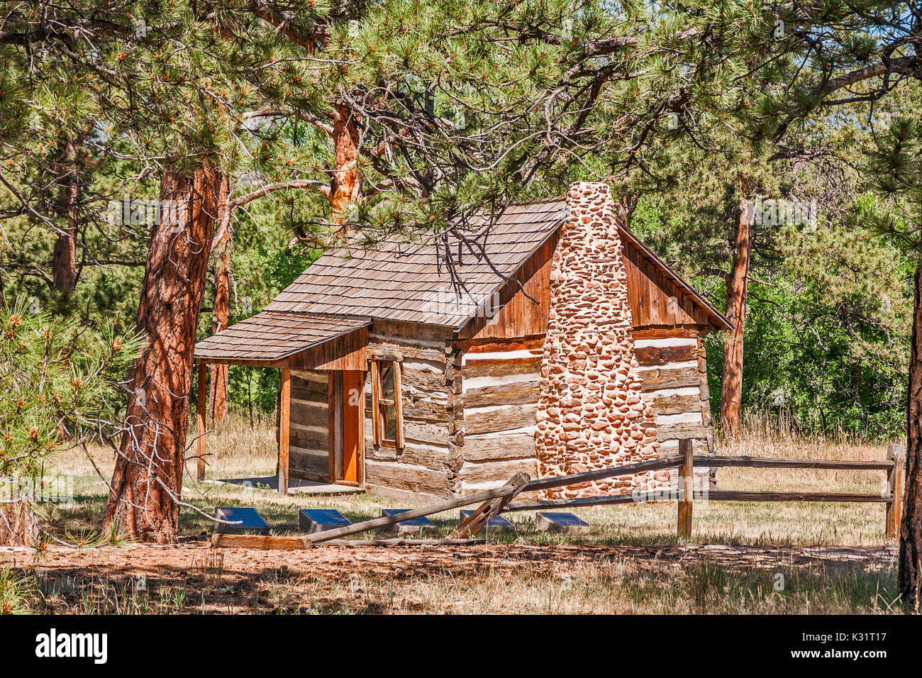 Log cabin on the edge of a forest built by pioneers in the 19th century ...