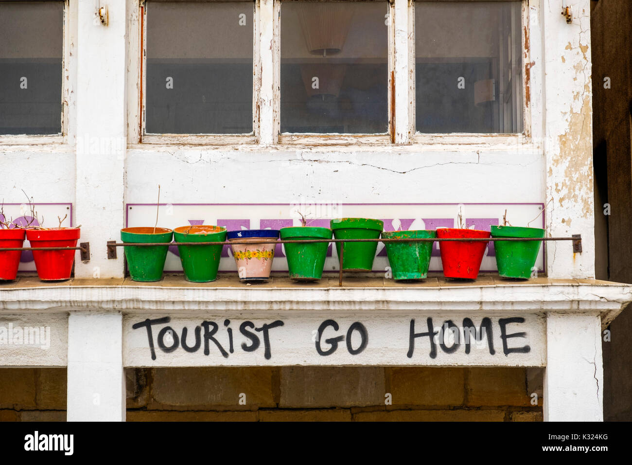 Tourist go home graffiti. Pasaia San Pedro. Fishing village. San ...