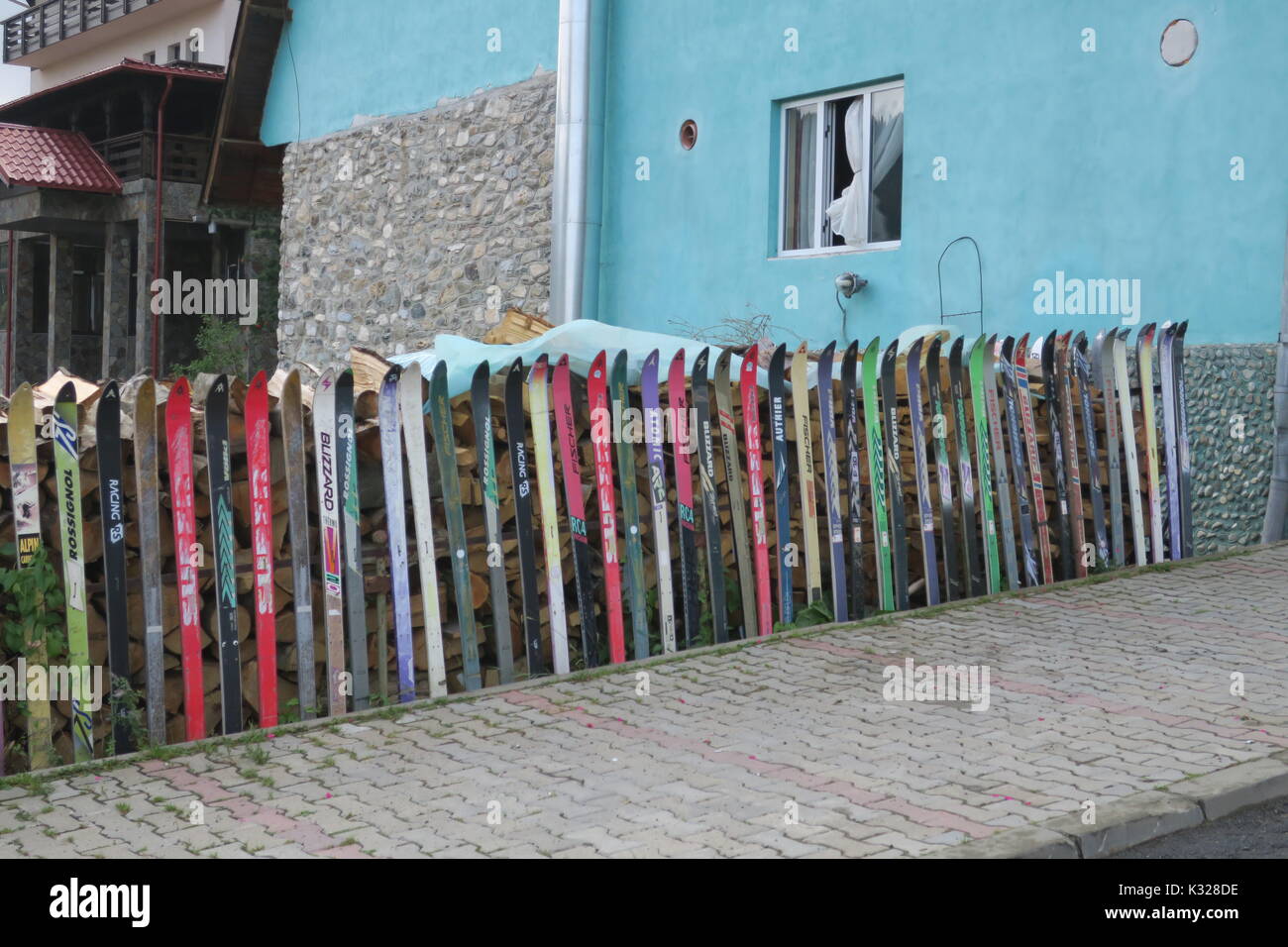 Colorful fence at chairlift, made of old skis in Borsa, Maramures ...