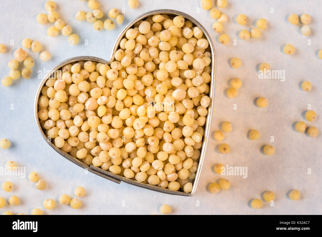 Uncooked Millet in a Heart Shape Stock Photo - Alamy
