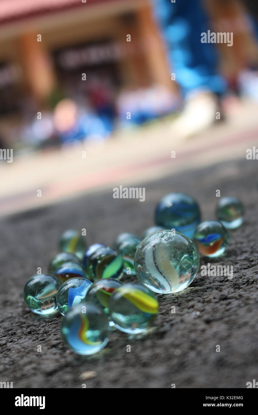 Few marble put on the ground Stock Photo - Alamy