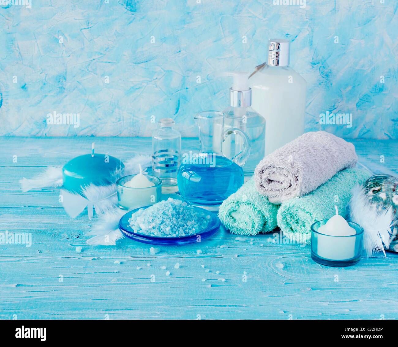 Set for spa with towels, salt and aromatic oils, candles and seashells ...