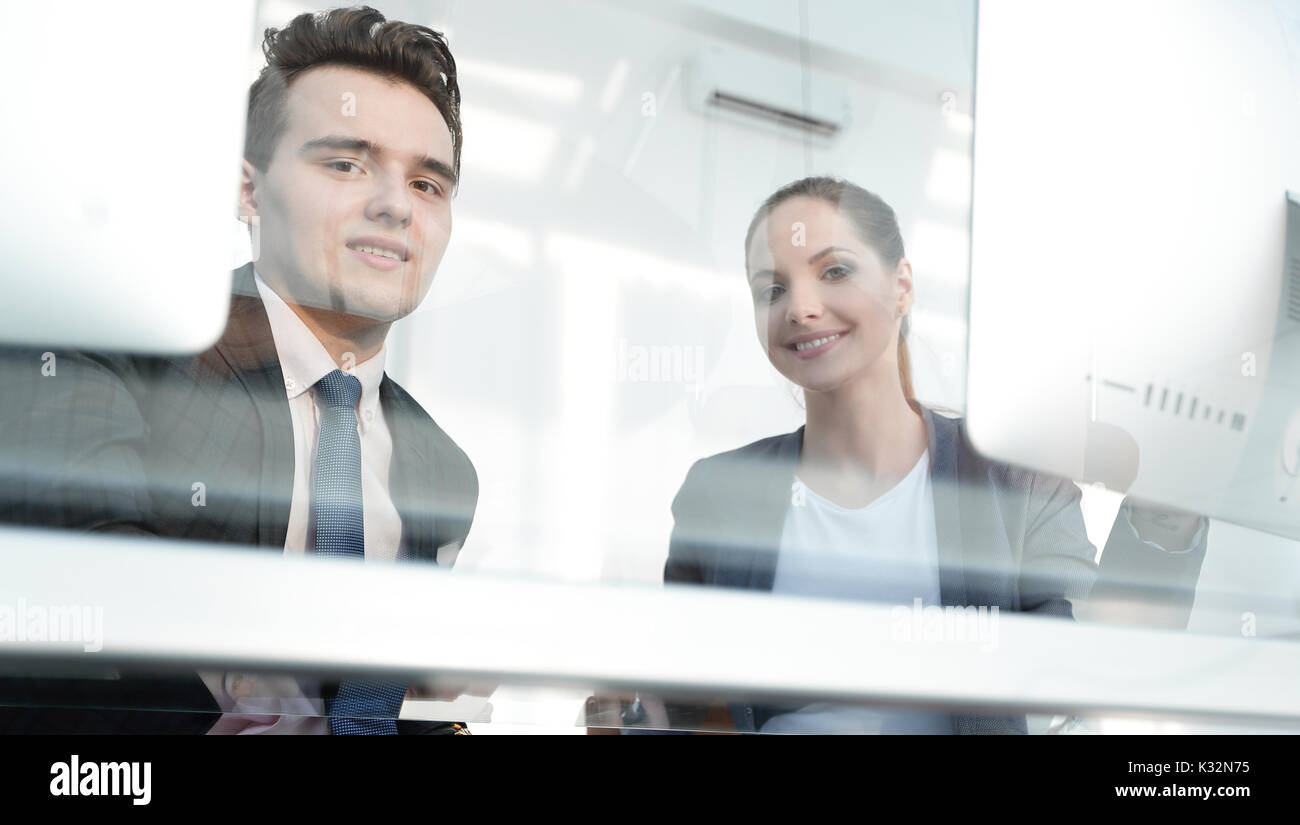 employees behind the window of a modern office Stock Photo - Alamy