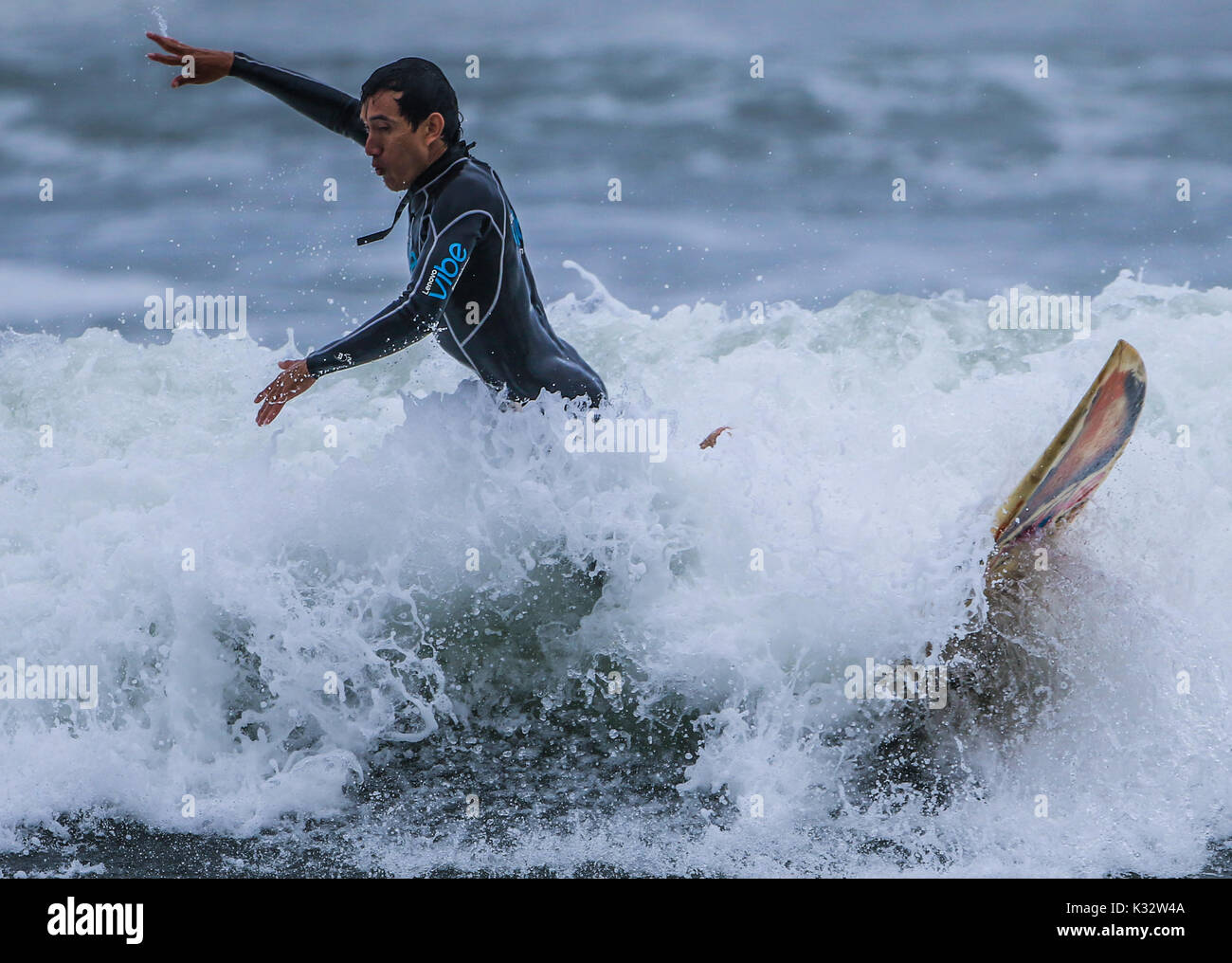 Surfing at Waikiki Beach in the tourist area of Miraflores in the ...