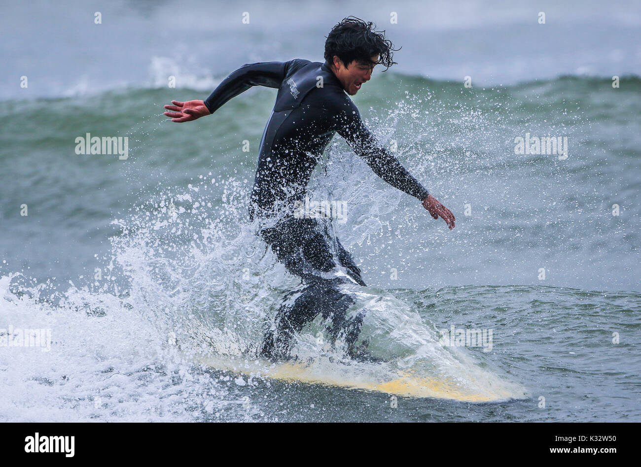 Surfing at Waikiki Beach in the tourist area of Miraflores in the ...