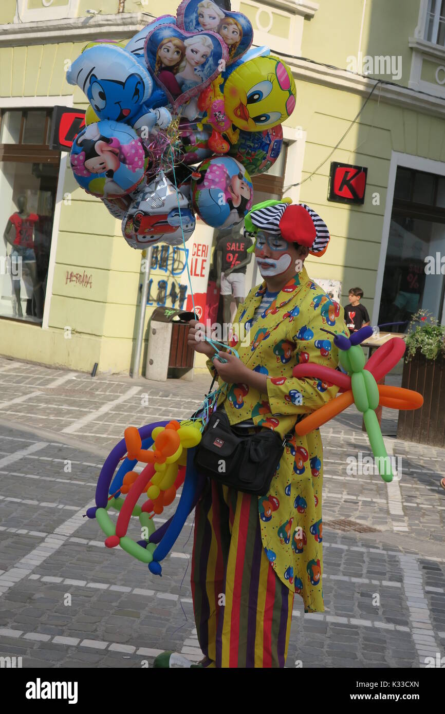 Clown with lots of baloons on a square of Brasov city, Romania Stock ...