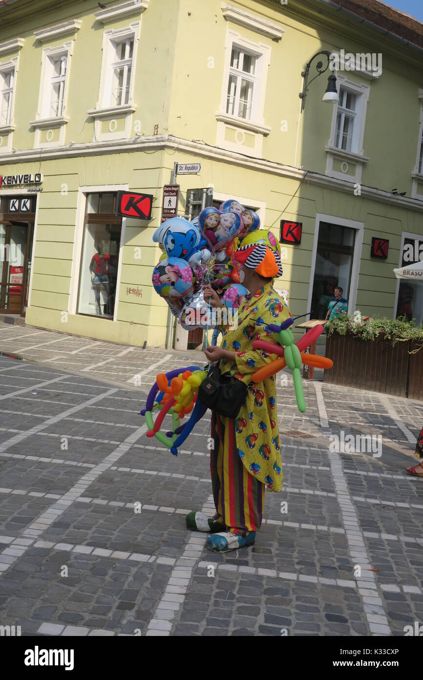 Clown with lots of baloons on a square of Brasov city, Romania Stock ...