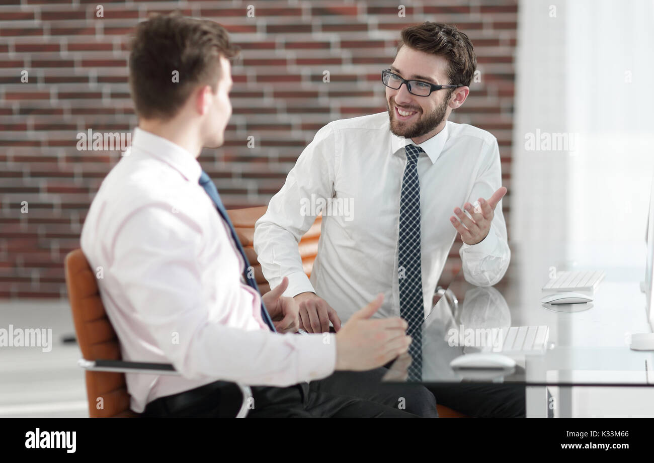 Manager talking with a colleague Stock Photo - Alamy