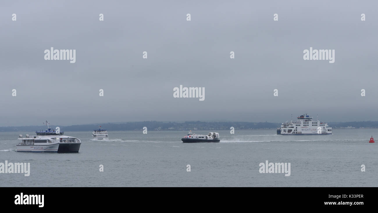 On a dull, grey, cloudy day a variety of ferries cross the Solent ...