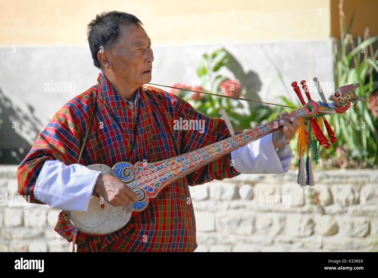 PARO, BHUTAN - November10, 2012 : Unidentified old man musician in ...