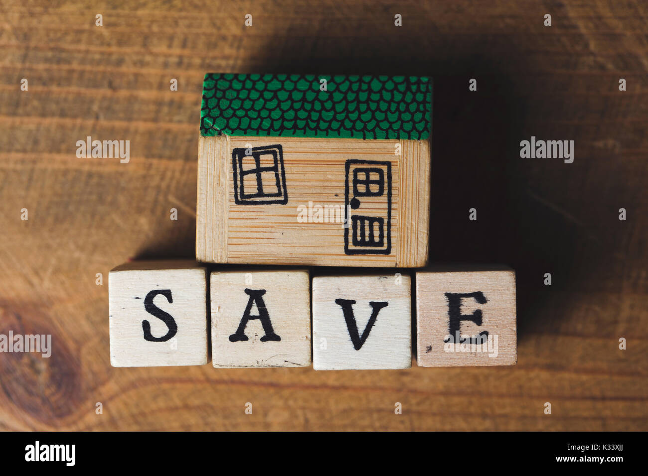 House model with save word made from wooden blocks. Home finance ...
