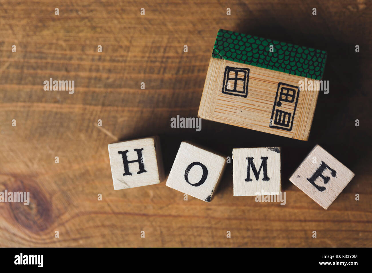 House model with home word made from wooden blocks Stock Photo - Alamy