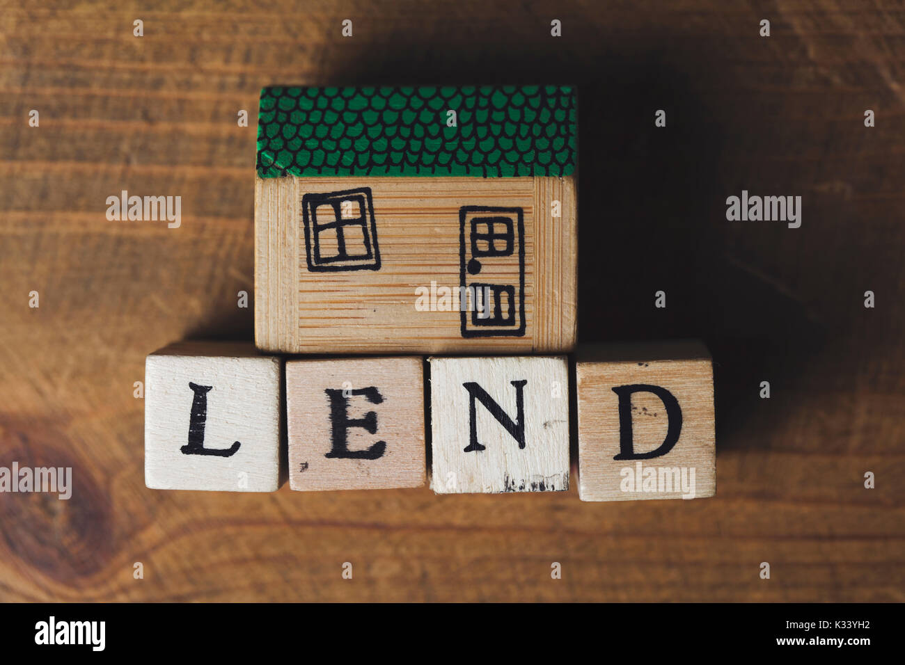 Home lending concept. House model with lend word made from wooden ...