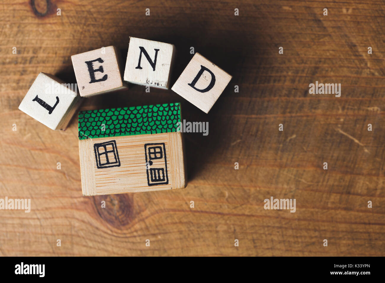 Home lending concept. House model with lend word made from wooden ...