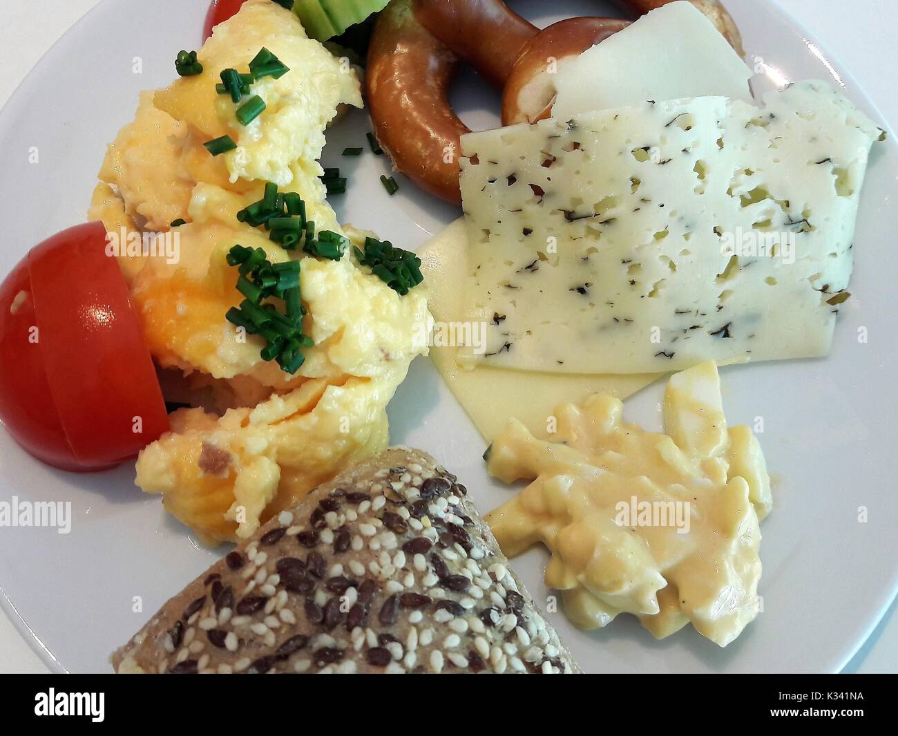 Healthy German Breakfast, scrambled eggs, cheese, pretzel Stock Photo ...
