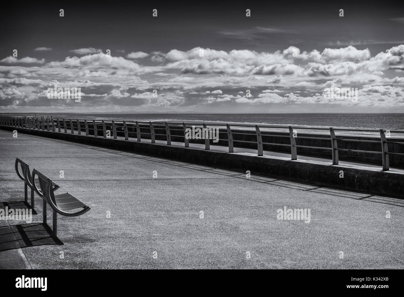Empty seating beaches looking out to sea across the beach on a sunny ...